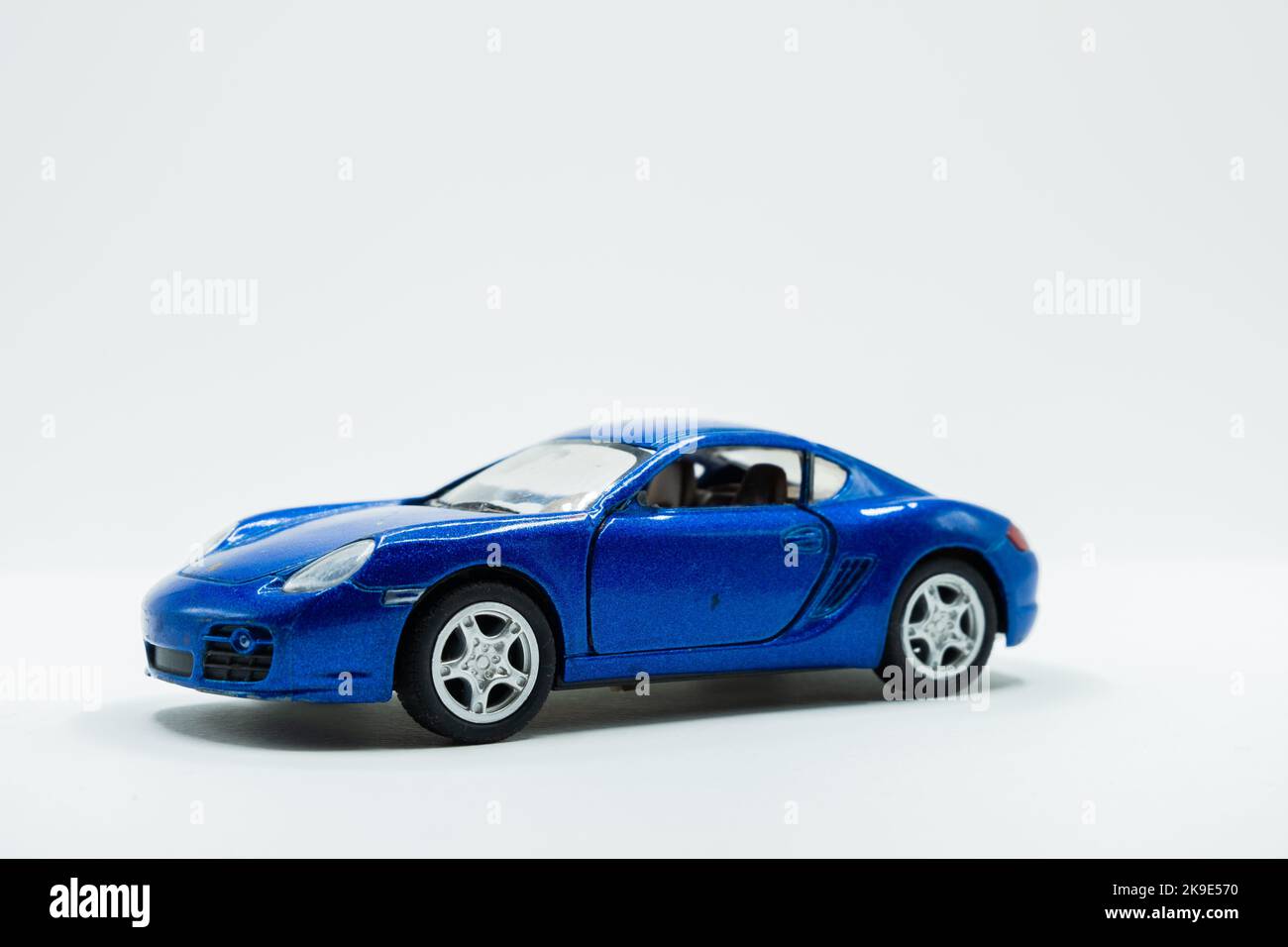 Side view of fast blue car toy Stock Photo - Alamy