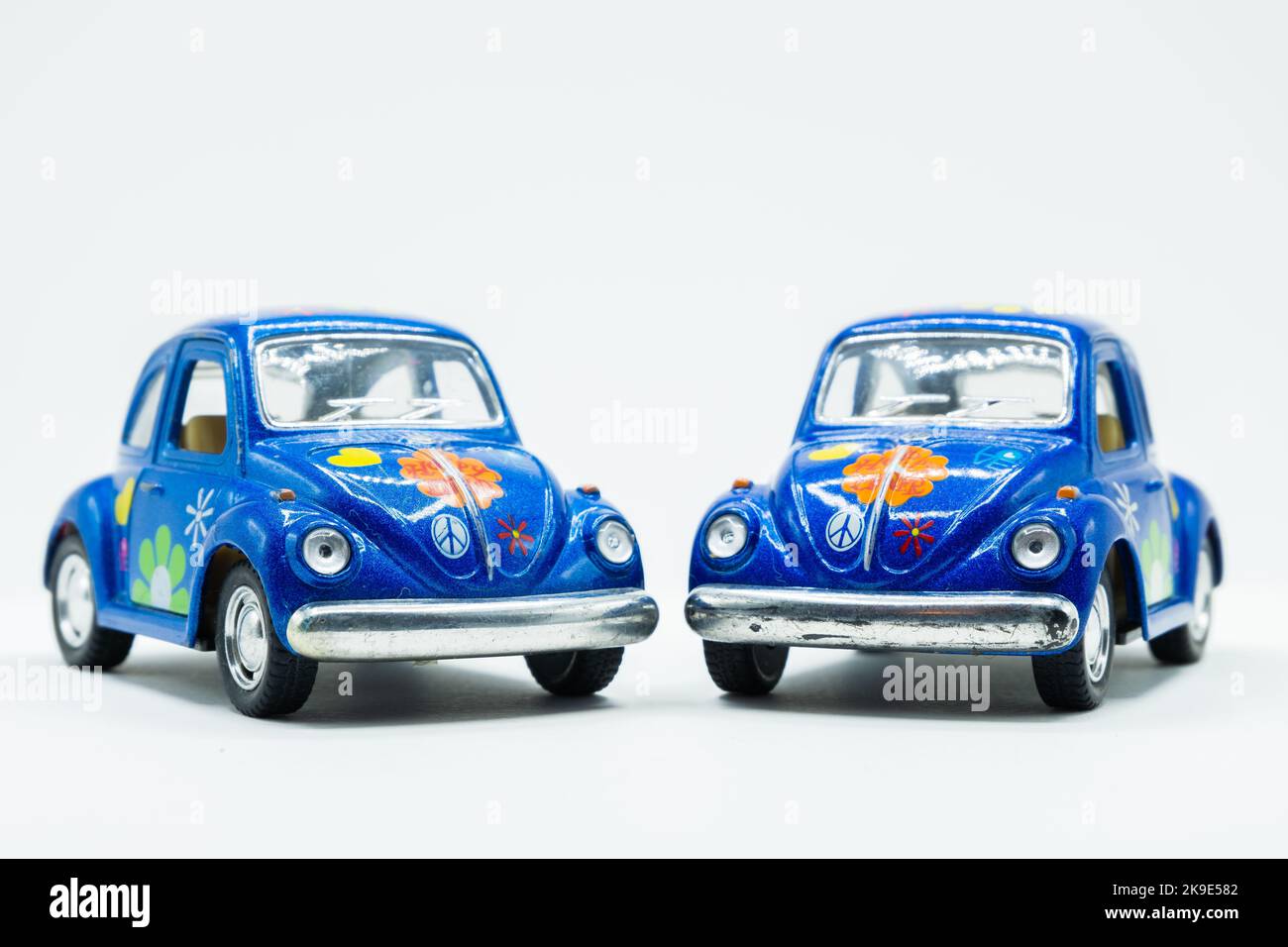 Blue vintage car with colorful flowers on white Stock Photo - Alamy