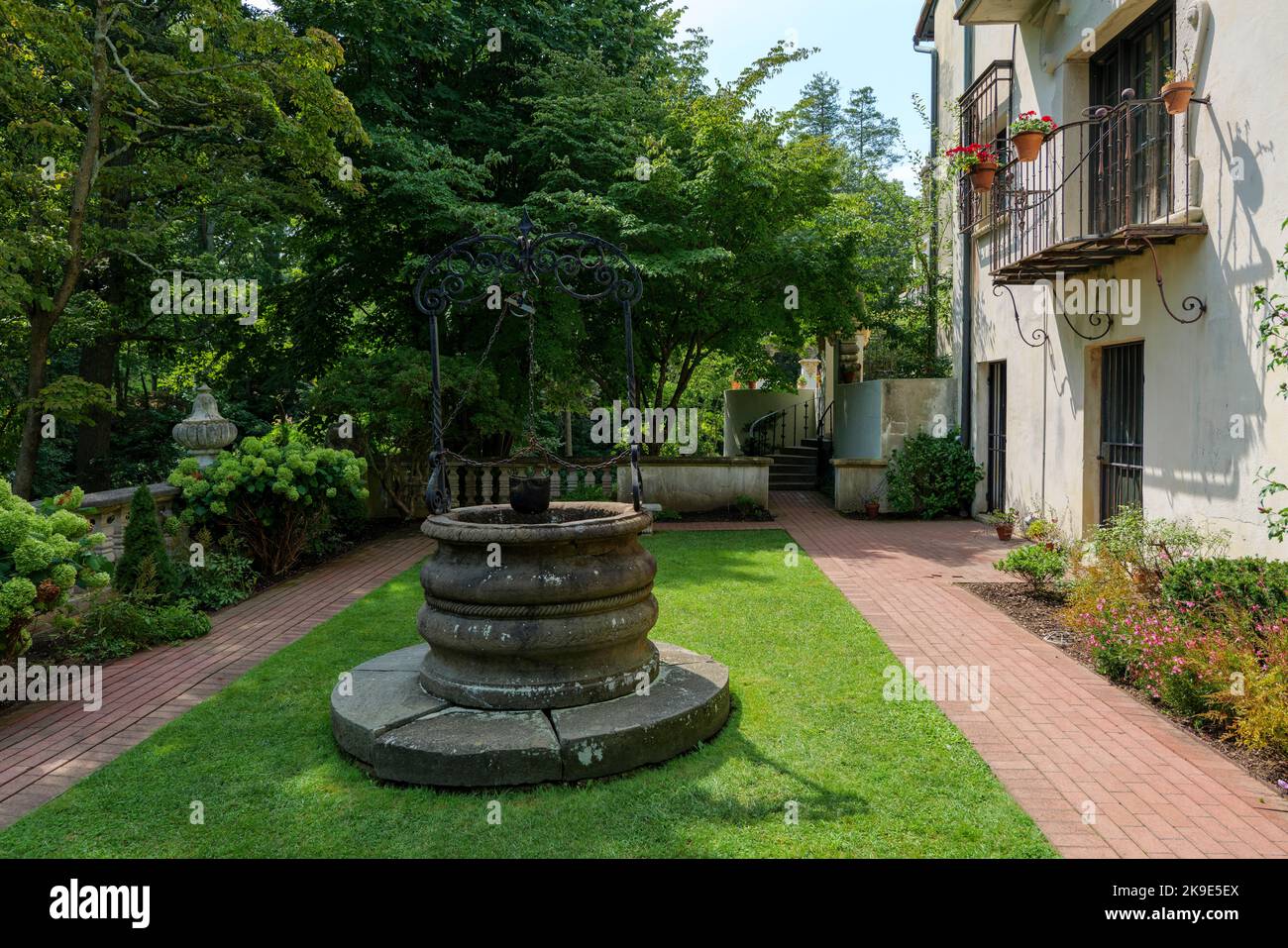 old well with a bucket and forged frame at Vanderbilt Museum Long ...