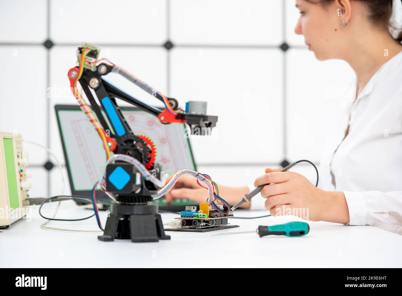 schoolgirl student experimenting with a 3D printed robot model Stock ...