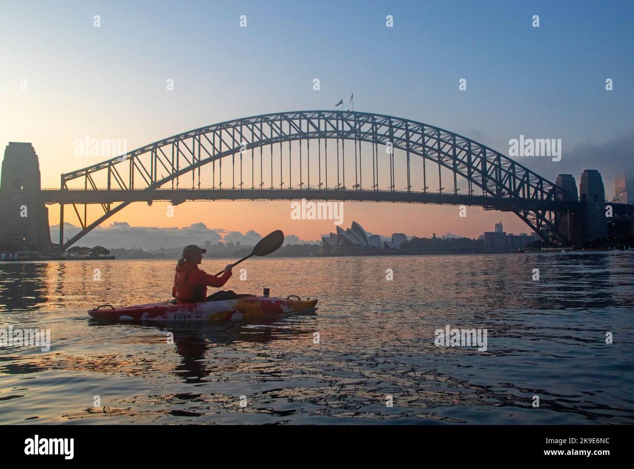 Kayaking on Sydney Harbour at dawn Stock Photo - Alamy
