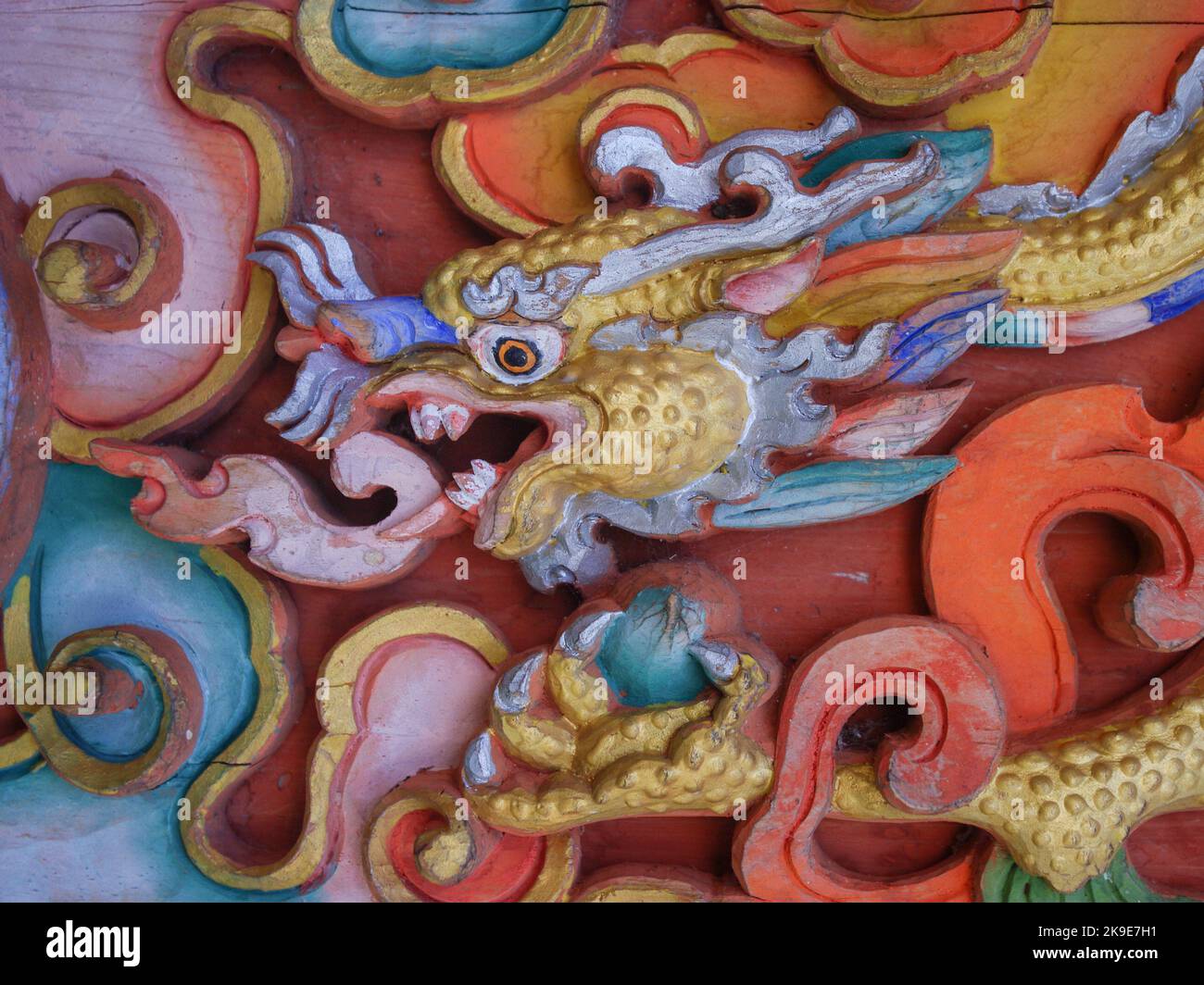 Beautiful colorful traditional bhutanese woodcarving of a dragon in ...