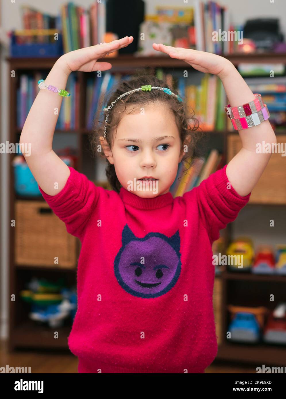 Young girl modeling her bracelets in a ballet stand Stock Photo - Alamy