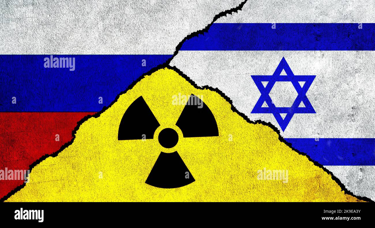 Flags of Russia, Israel and Nuclear symbol together on textured wall ...