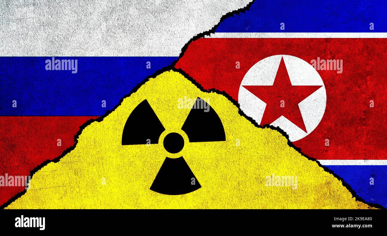 Flags of Russia, North Korea and Nuclear symbol together on textured ...