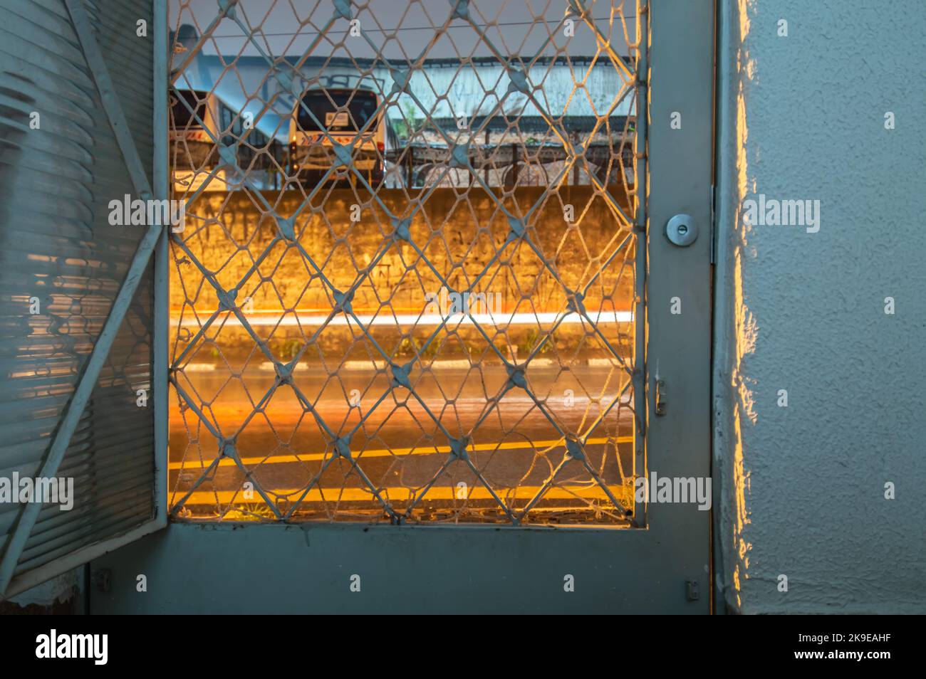 Open door with street lights outside, pleasant environment and long ...