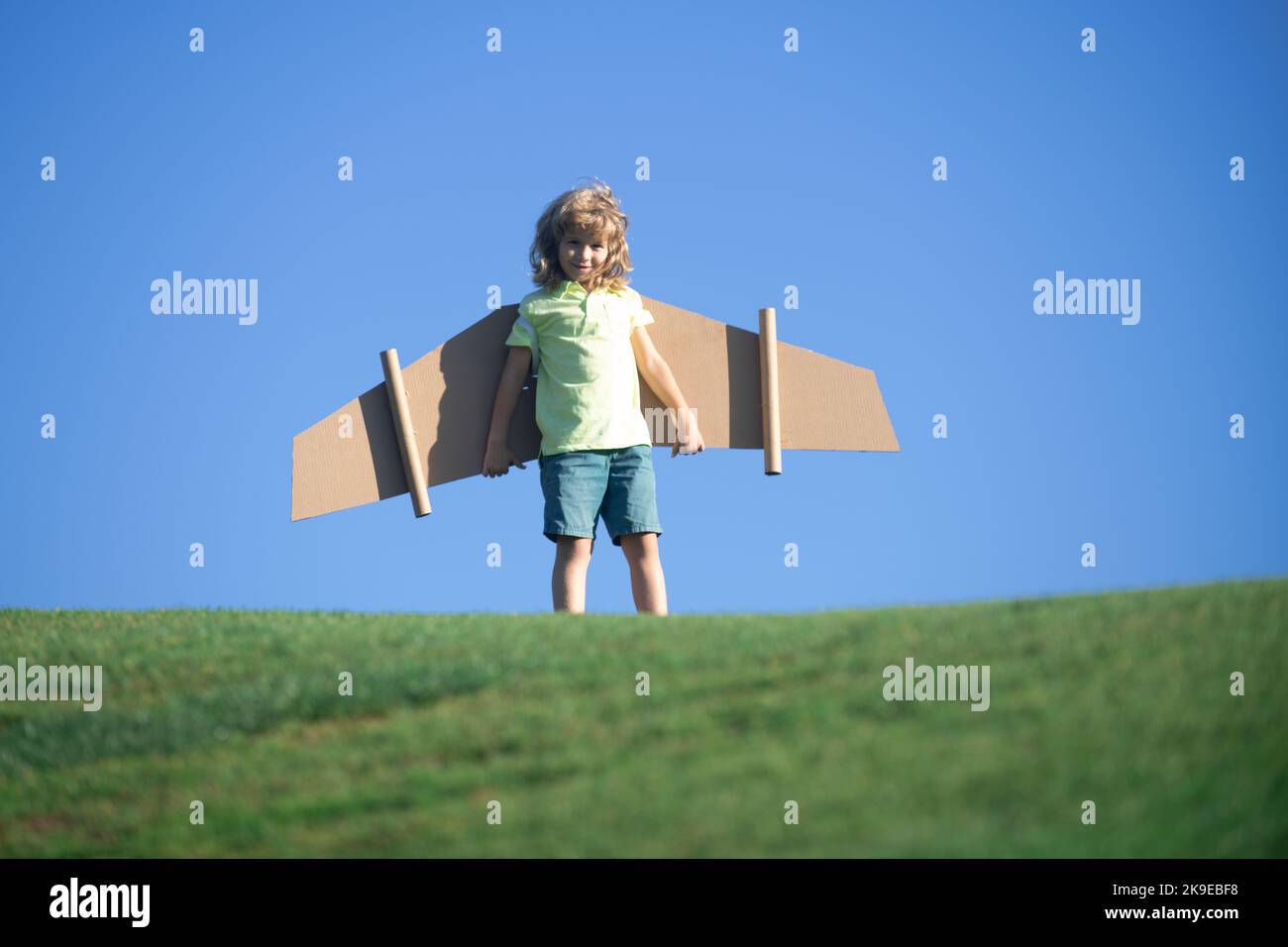 Child boy playing pilot on the sky blue background. Kid dreaming. Child ...