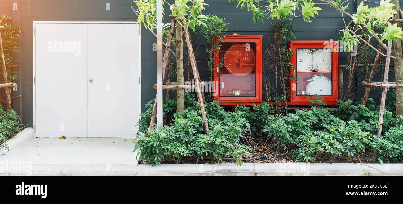Fire extinguisher and water pump system on the wall, powerful emergency ...