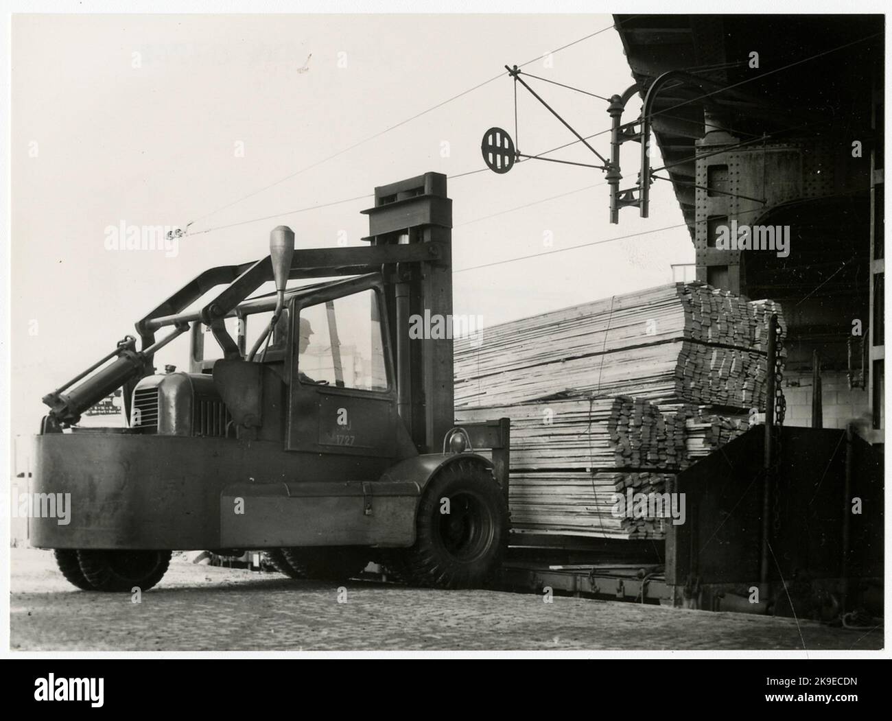 Wood handling with larger forklift in Liljeholmen Stock Photo - Alamy