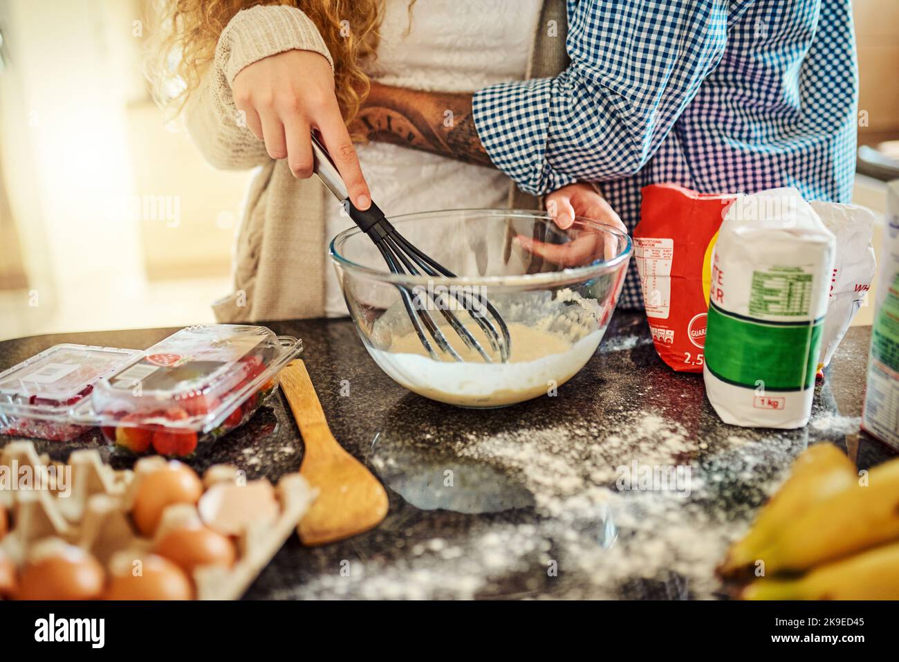 Whisk me off my feet. an unrecognizable couple baking in the kitchen ...