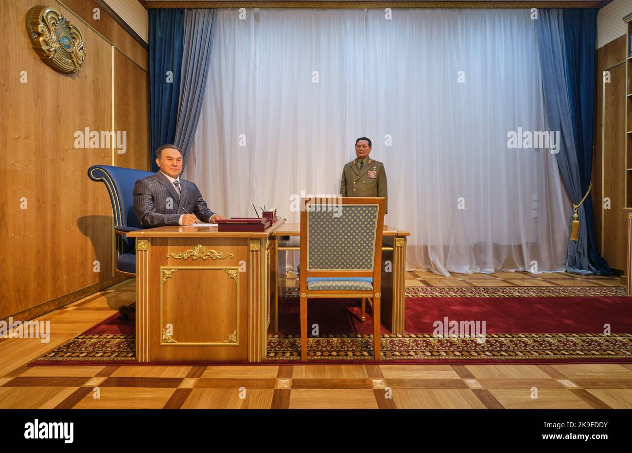 A recreation, diorama, figure of President Nursultan Nazarbayev signing ...