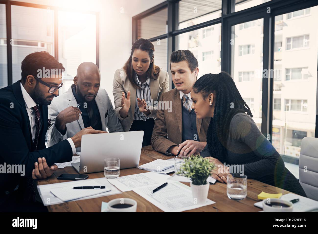 Teamwork accomplishes business tasks. a group of young businesspeople ...