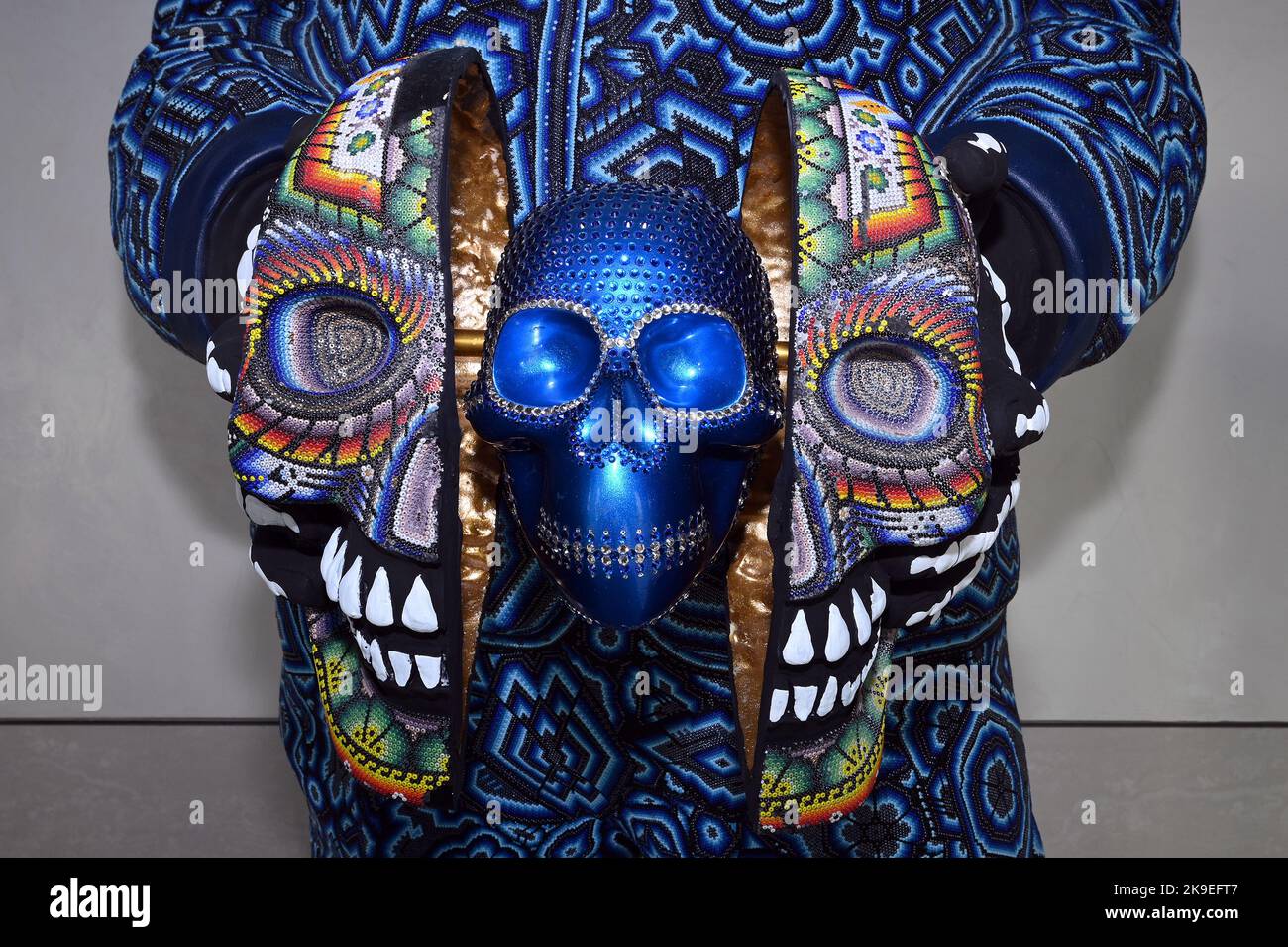 A close up of a bejeweled skull of a sculpture titled El Creador de las ...