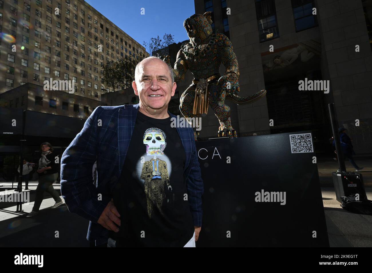Artist Cesar Menchaca poses in front of his art installation at ...