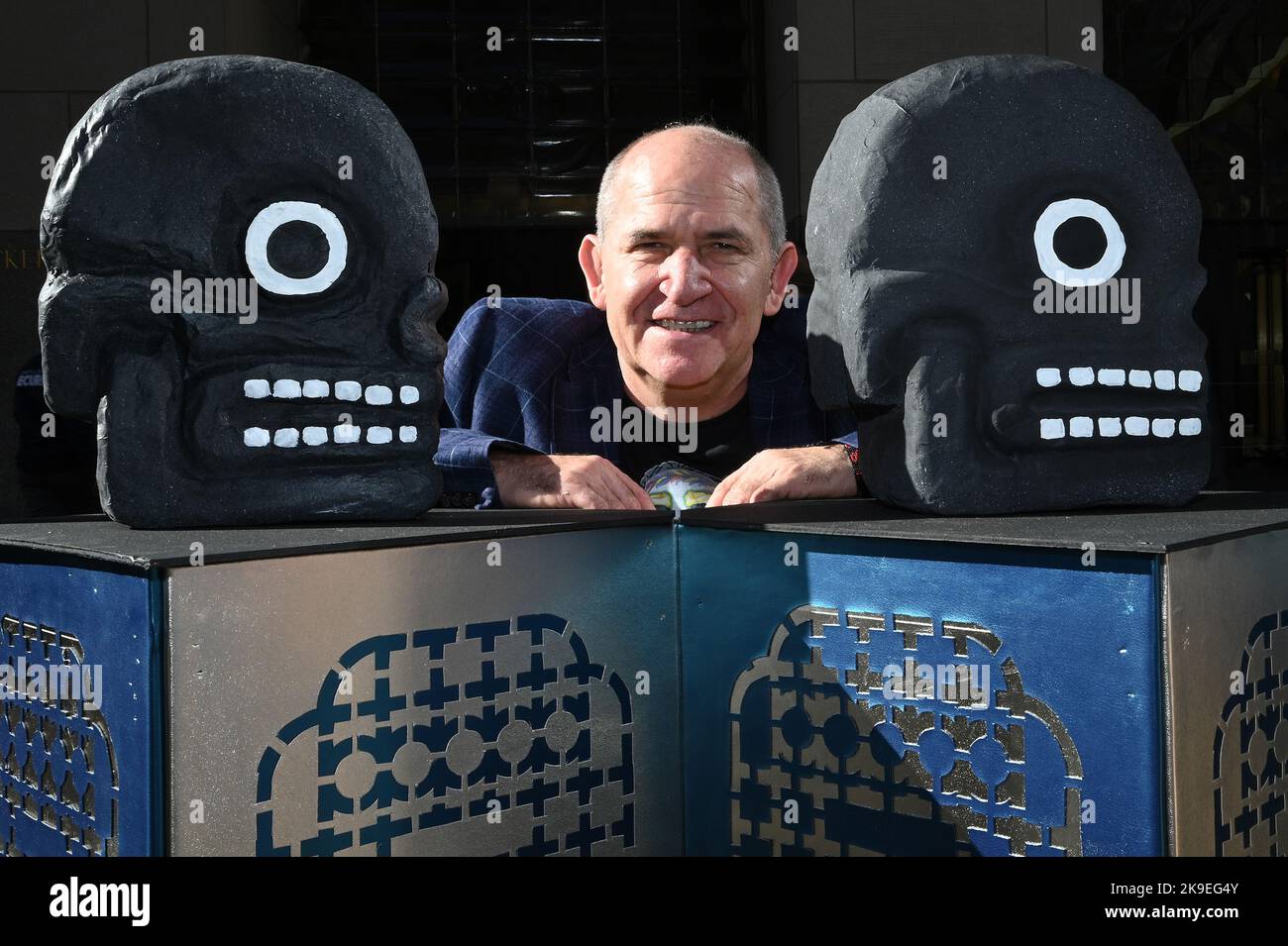 Artist Cesar Menchaca poses in front of an art installation at ...