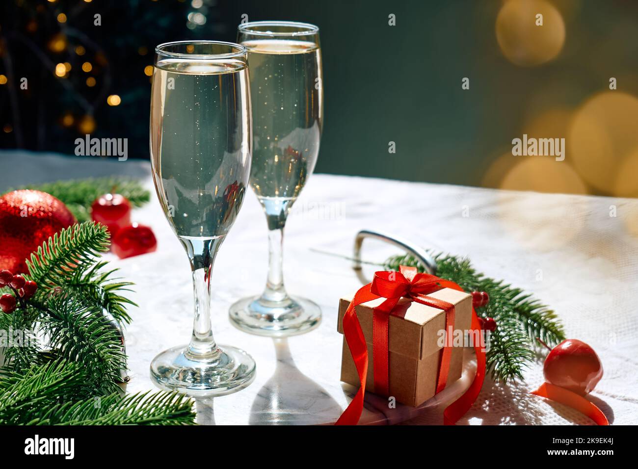 Christmas cocktail with sparkling wine decorated with cherry. Winter ...