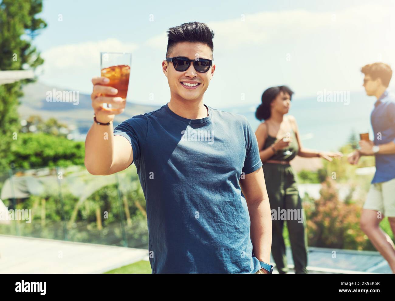 Cheers to everyone back home. Portrait of a handsome young man raising ...