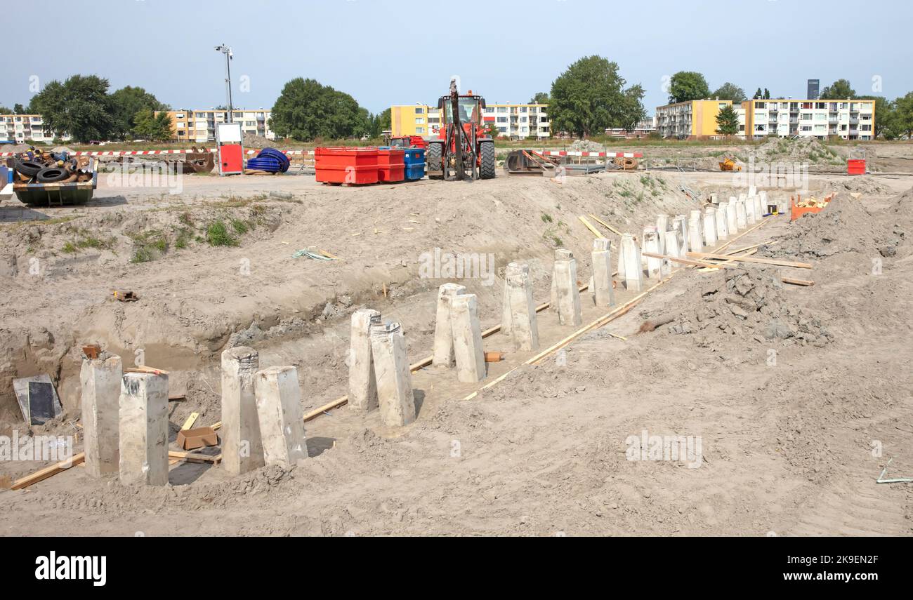 Concrete piles foundation for a new building on construction site ...