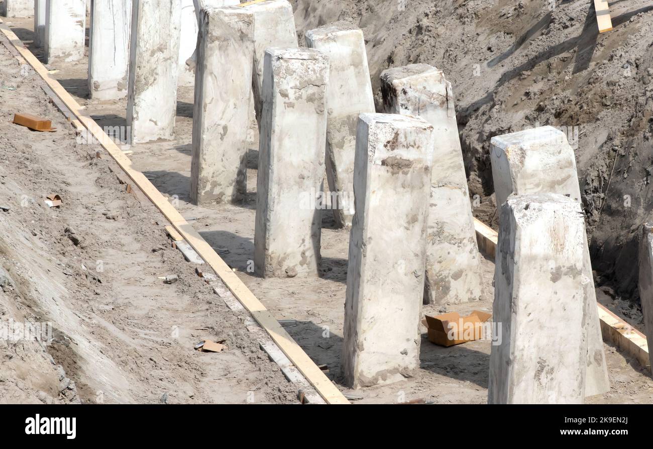 Concrete piles foundation for a new building on construction site ...