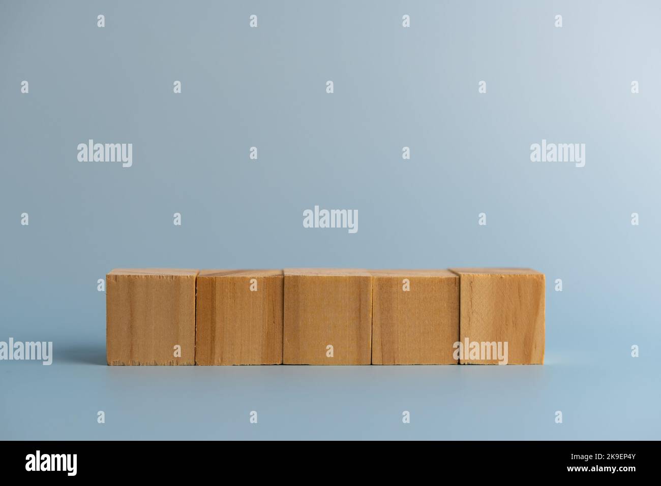 Five blank wooden block cubes on background for your text. Business ...