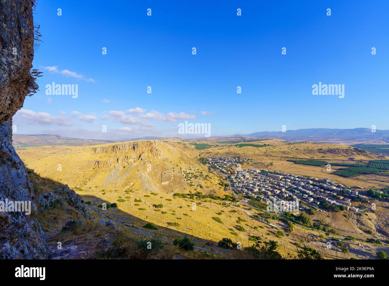 View of rocks, cliffs, footpath, and the Arab Village Wadi Hamam, in ...