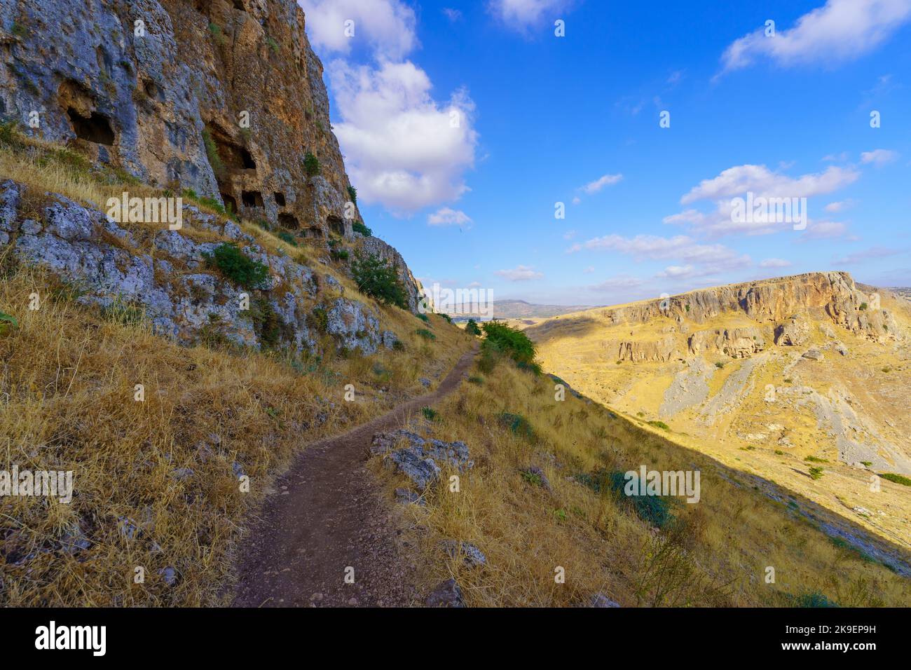 View of ancient hiding caves on a cliff, and Mount Nitai, in Mount ...