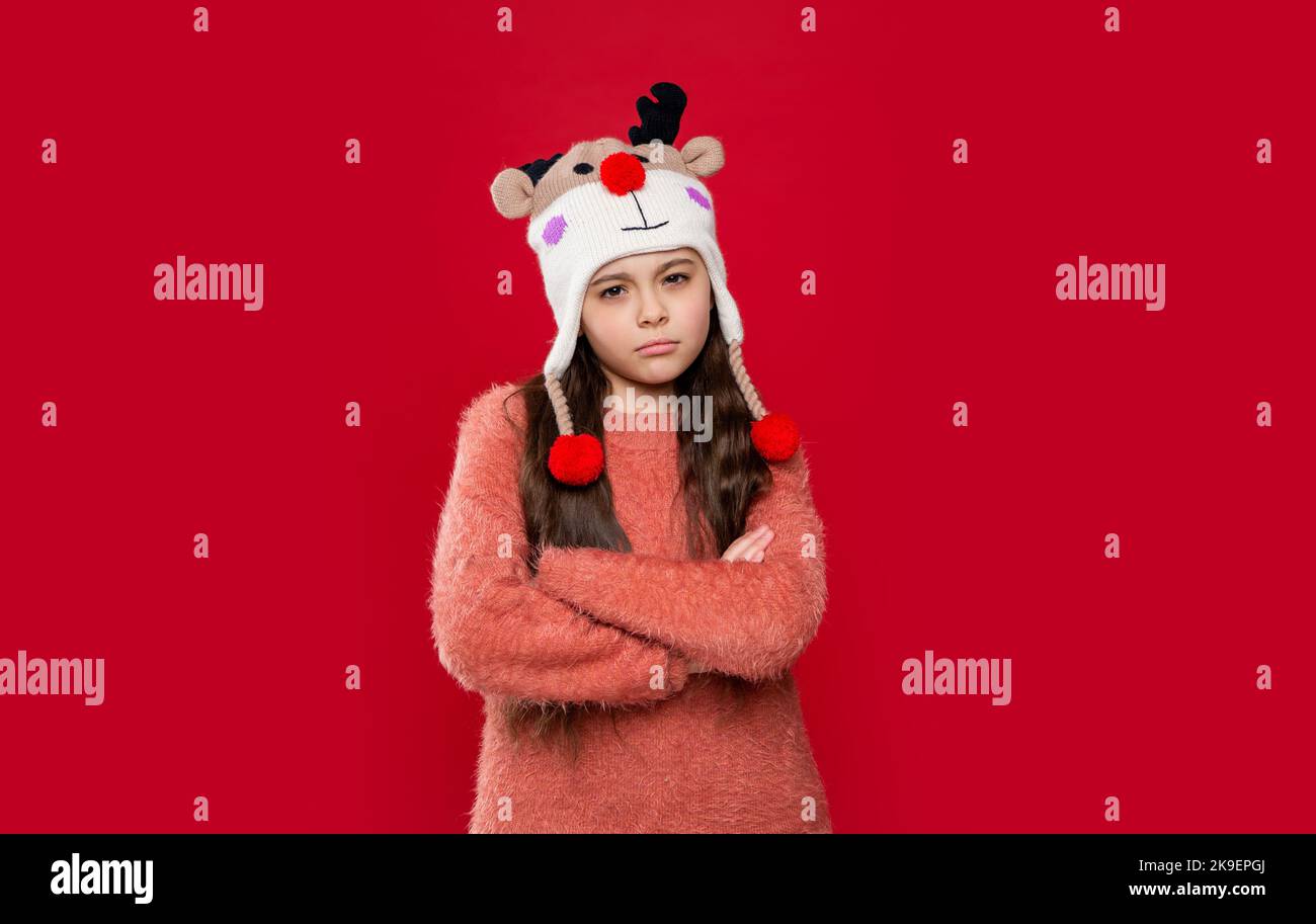 serious teen kid fashion model in winter earflap hat. teen kid in ...