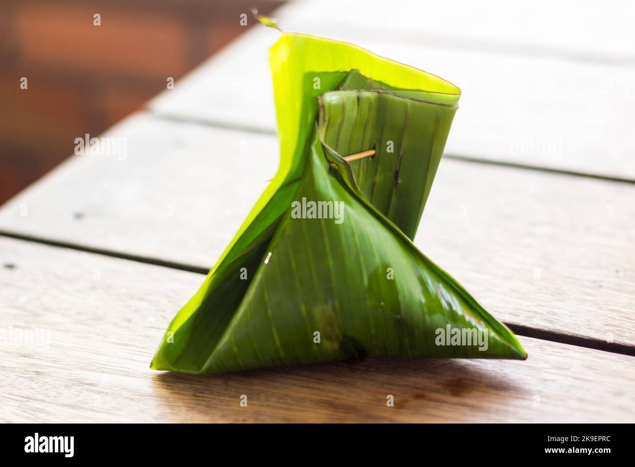 A traditional thai dessert wrapped in banana leaf in Phuket, Thailand ...