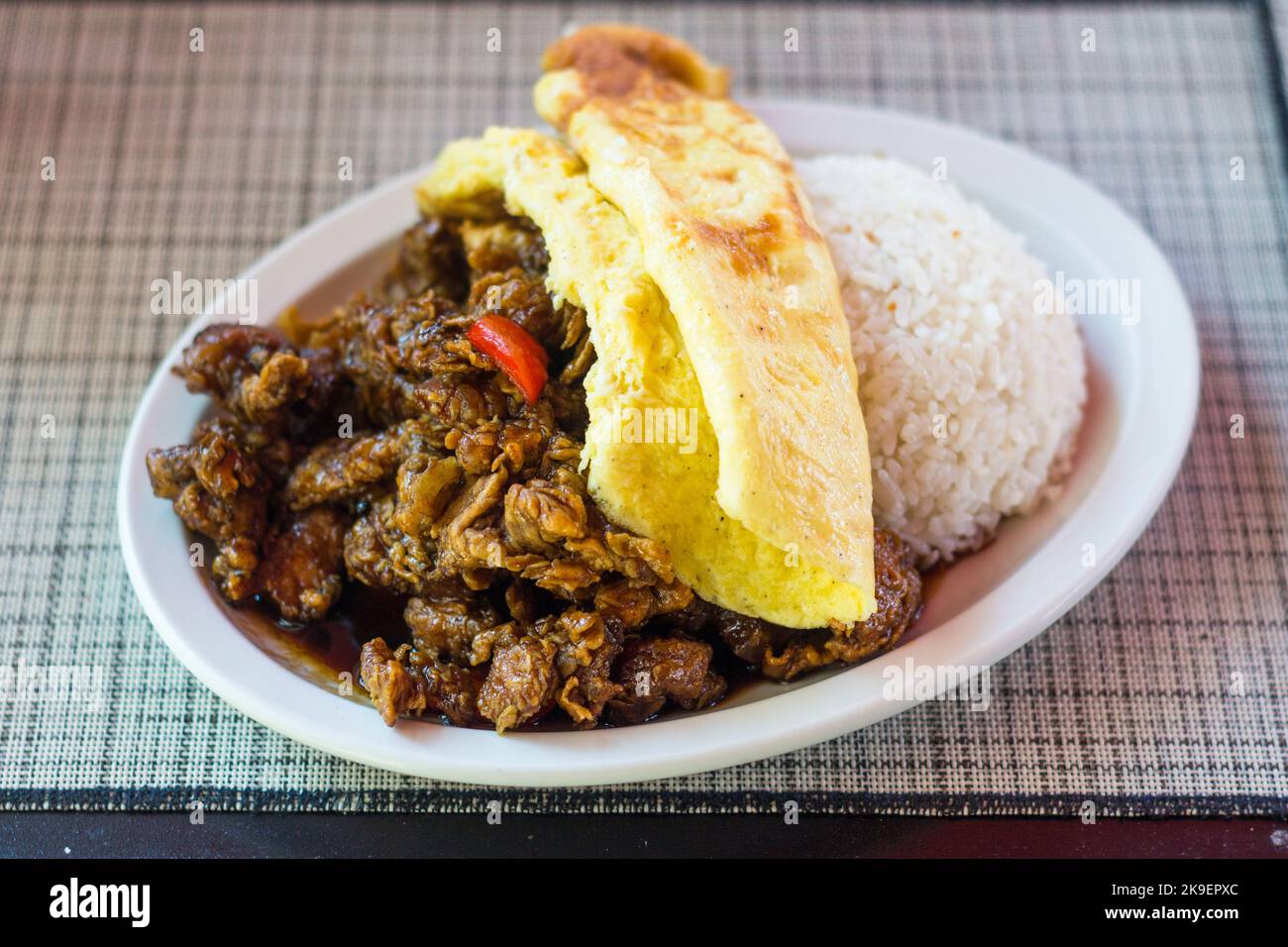 Tapsilog, a popular Filipino rice dish with sauteed beef and egg in ...