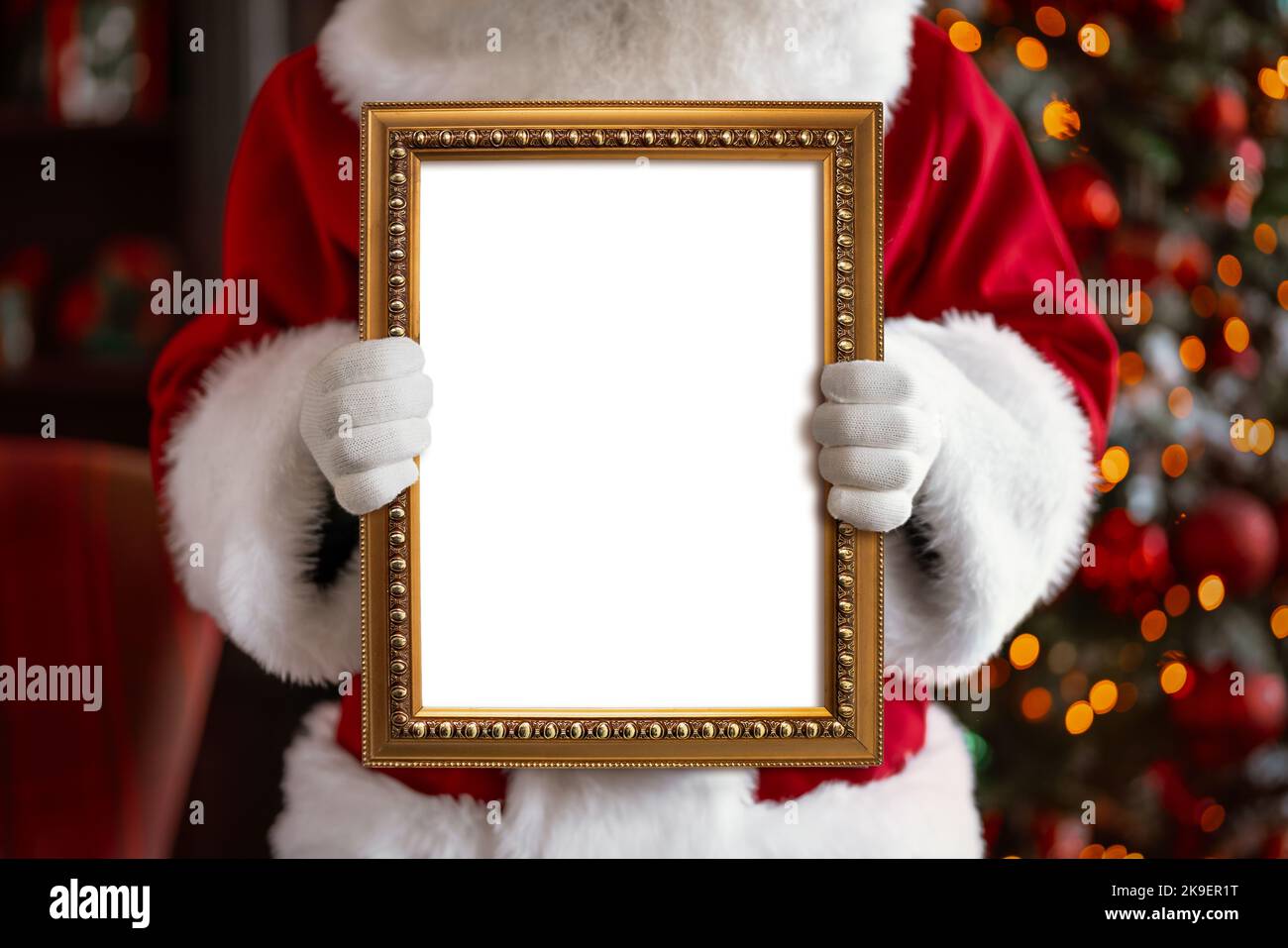 Santa Claus holding white frame in his hands Stock Photo - Alamy