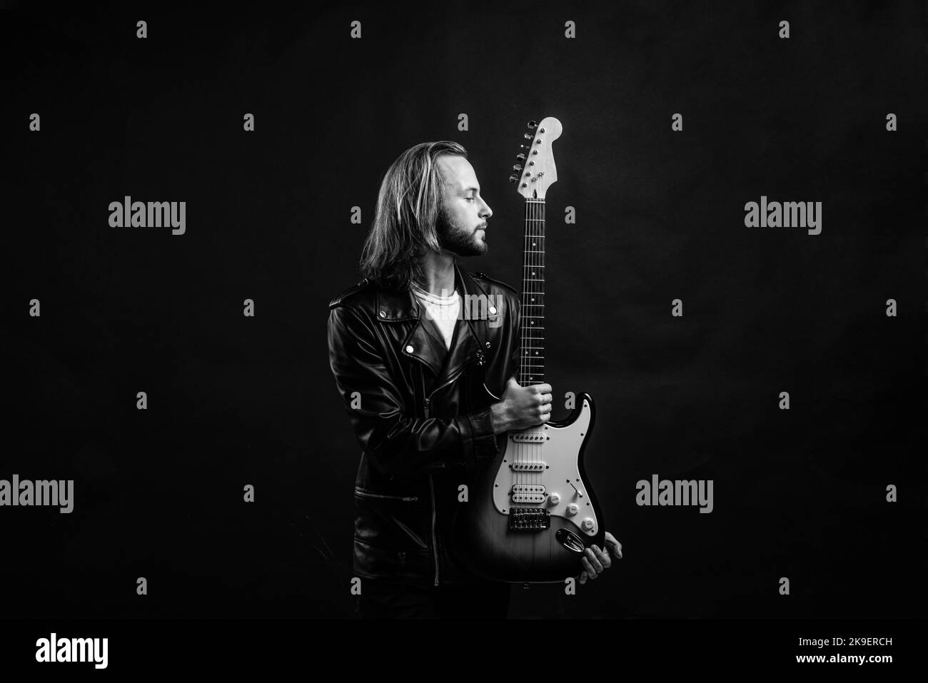 rock music style star. musician guitar player. masterfully playing rock ...