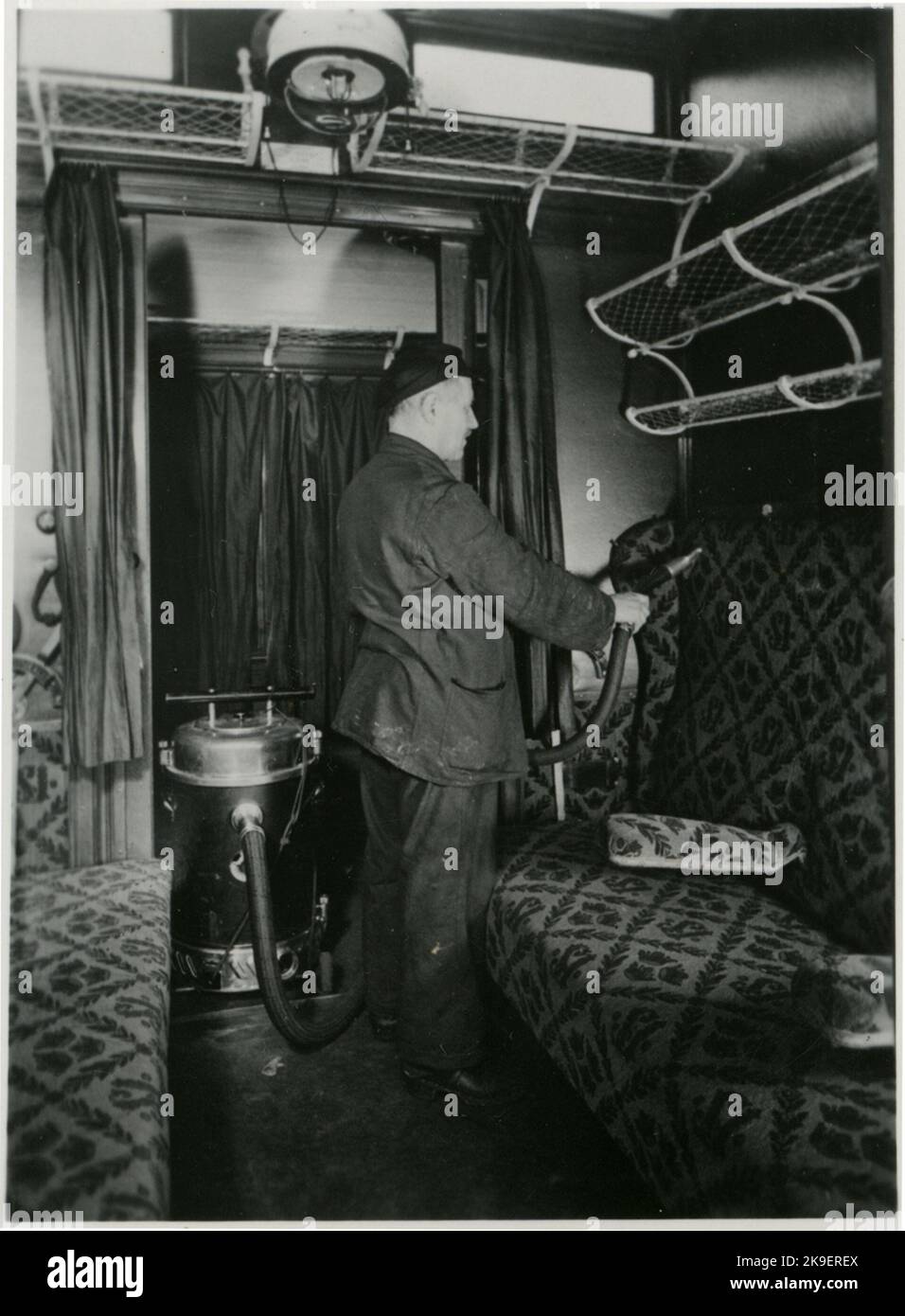 Tomteboda. State Railways, SJ. The main workshop. Vacuuming of sofas in ...
