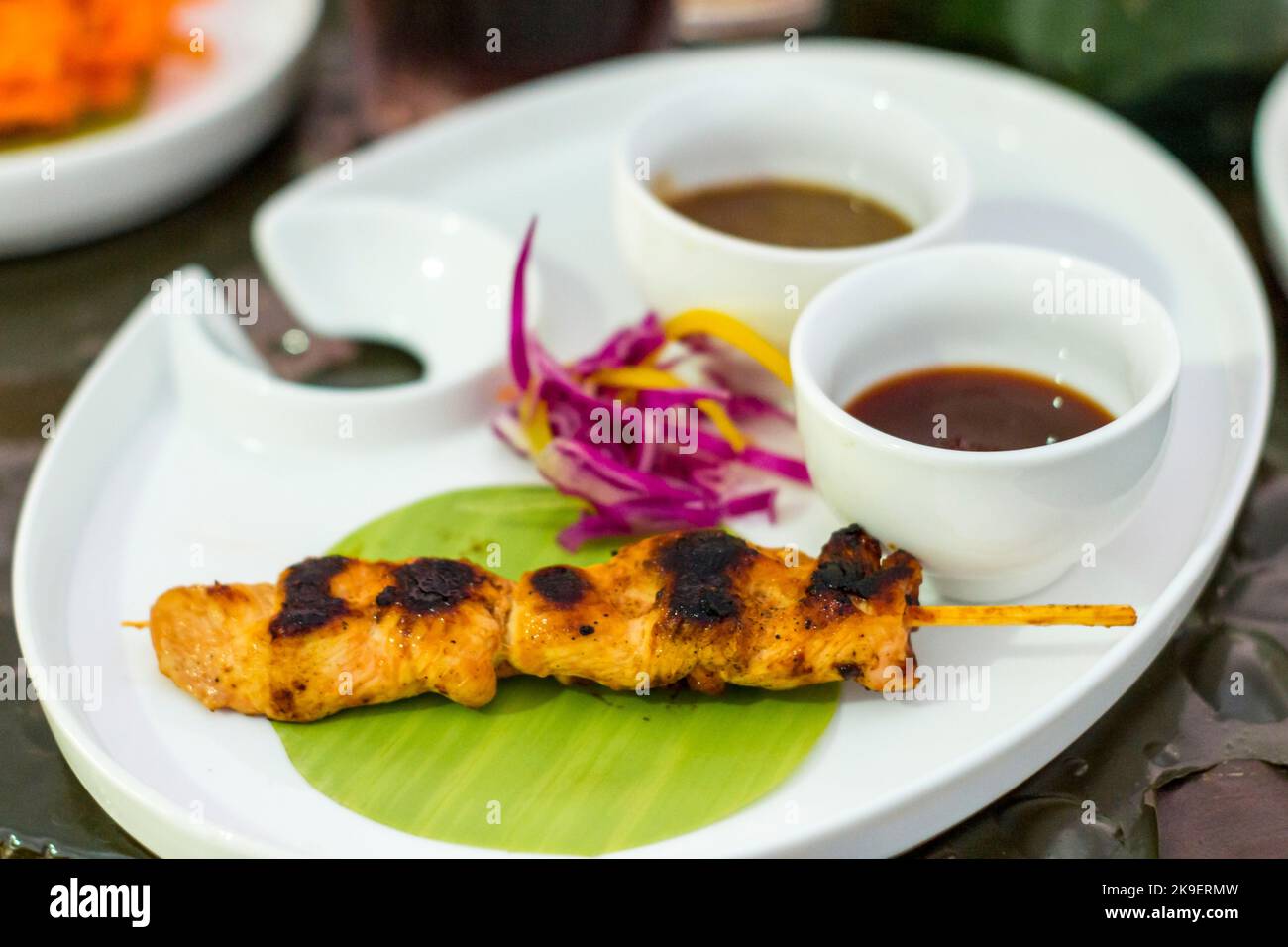 Filipino pork barbecue with condiments in Manila, Philippines Stock ...
