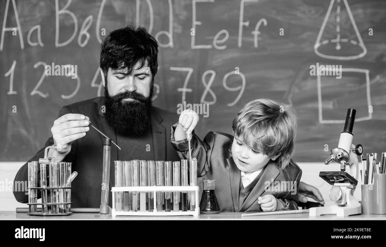 Perseverance pays off. Teacher and child test tubes. School lesson ...