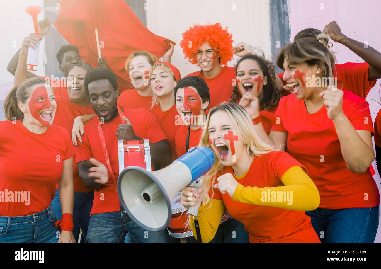 Group of joyful diverse fans screaming during football match Stock ...