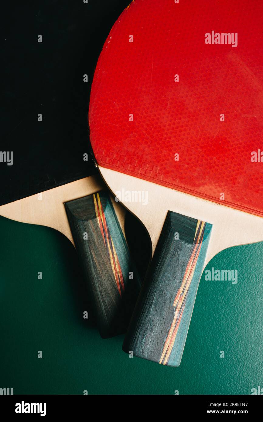 Two ping pong rackets are on the green game table Stock Photo - Alamy