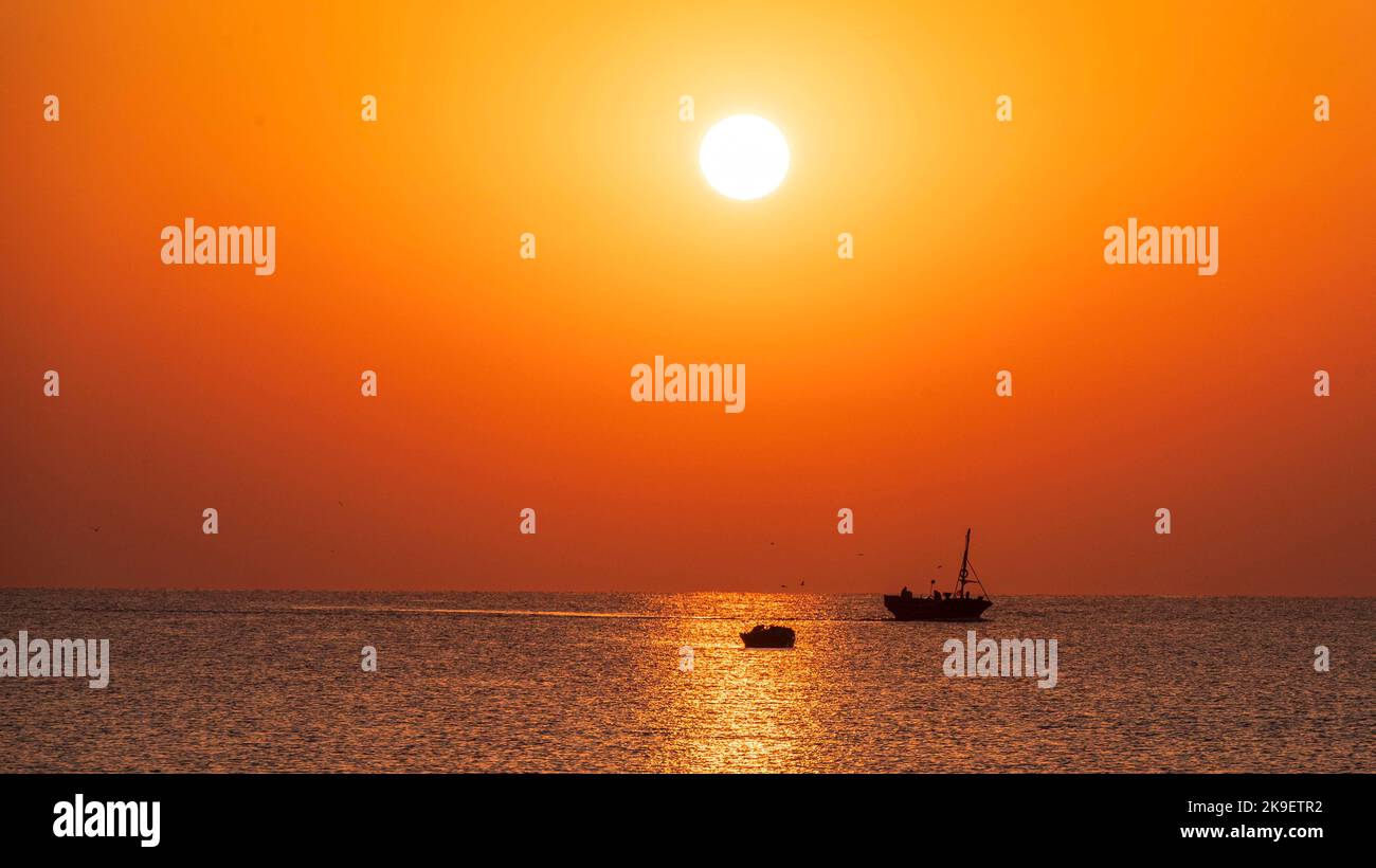 The golden sun is rising in the morning over Beidaihe, Qinhuangdao City ...