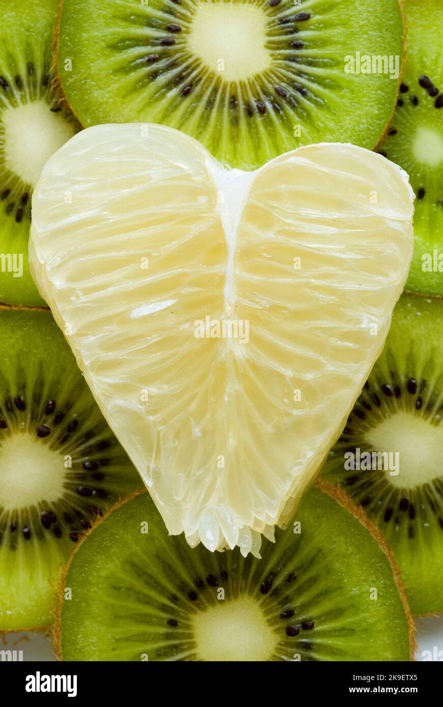 Pomelo slice on slices of Kiwi fruit Stock Photo - Alamy