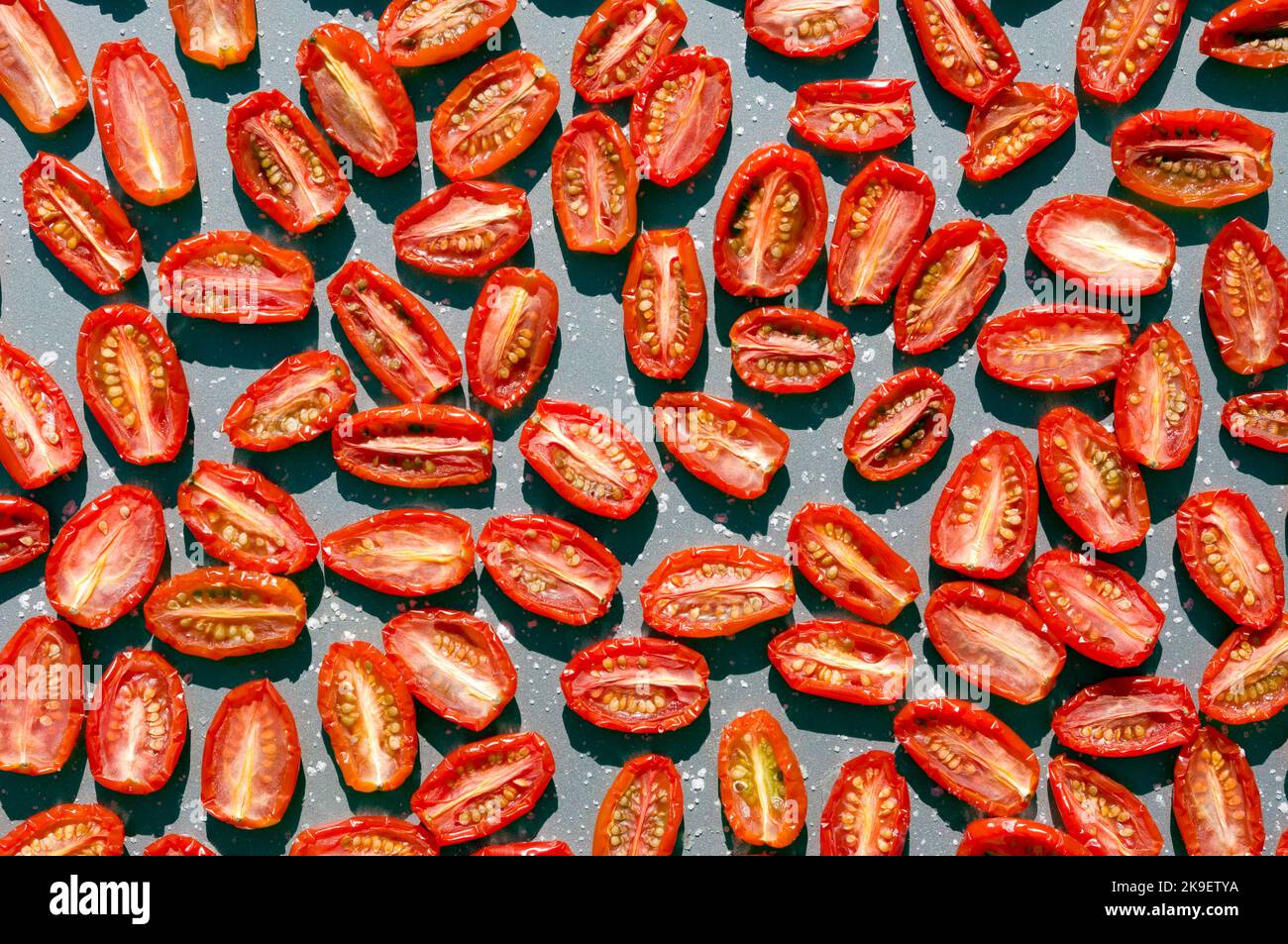 Baby plum tomatoes drying in the sun Stock Photo - Alamy