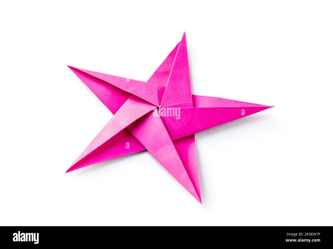 Pink paper star origami isolated on a blank white background Stock ...