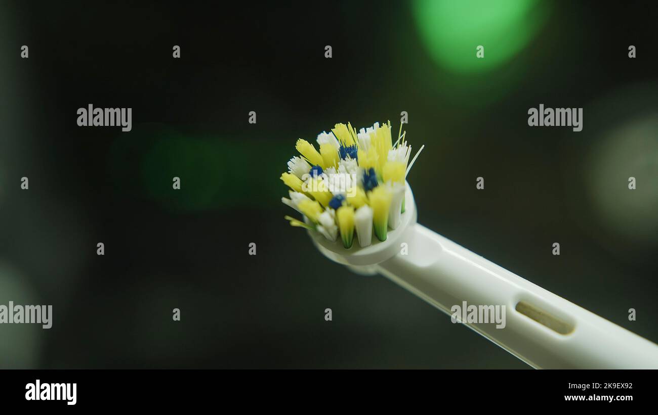 Used head of white electric toothbrush extreme close-up macro rotating ...