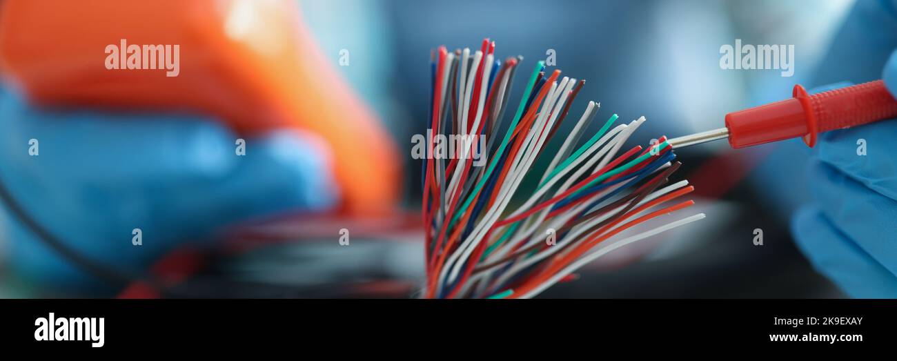 Man measuring voltage with special equipment, tool for checking ...