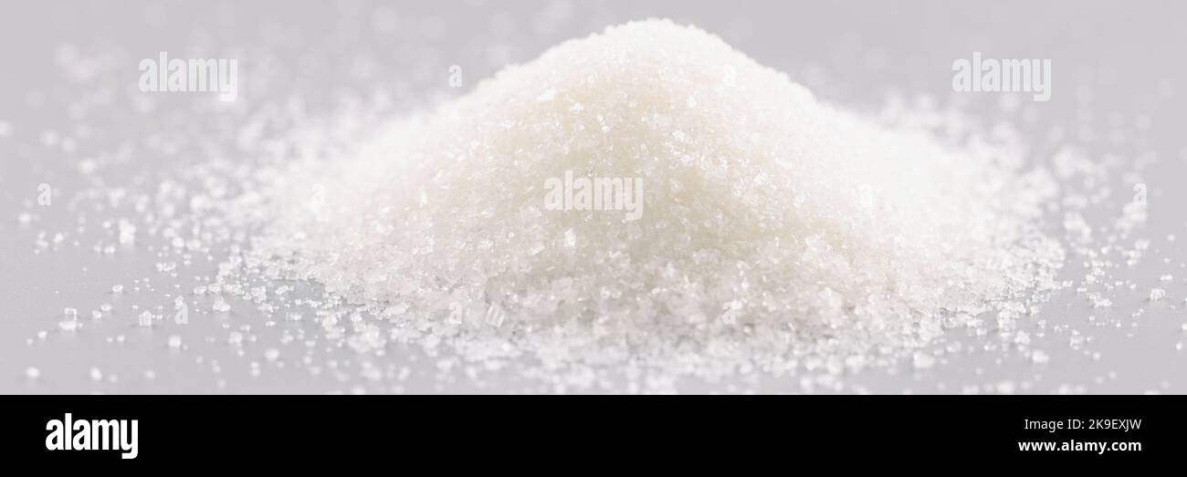 Sugar crystals pile on grey background, heap of sweet powder, sugar ...