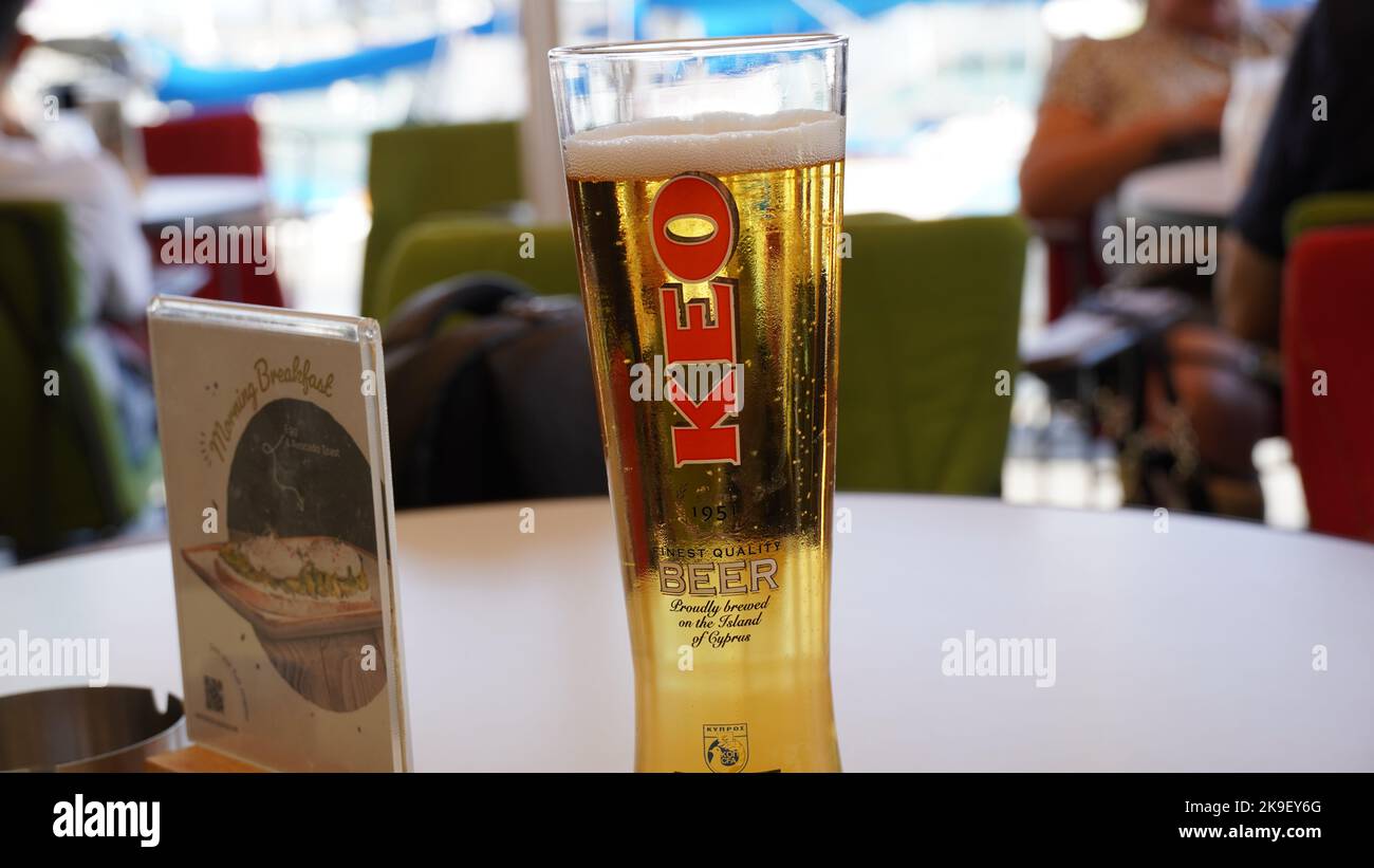 Limassol, Cyprus - October 10, ‎2022: a glass of KEO, a Cypriot Pilsner ...