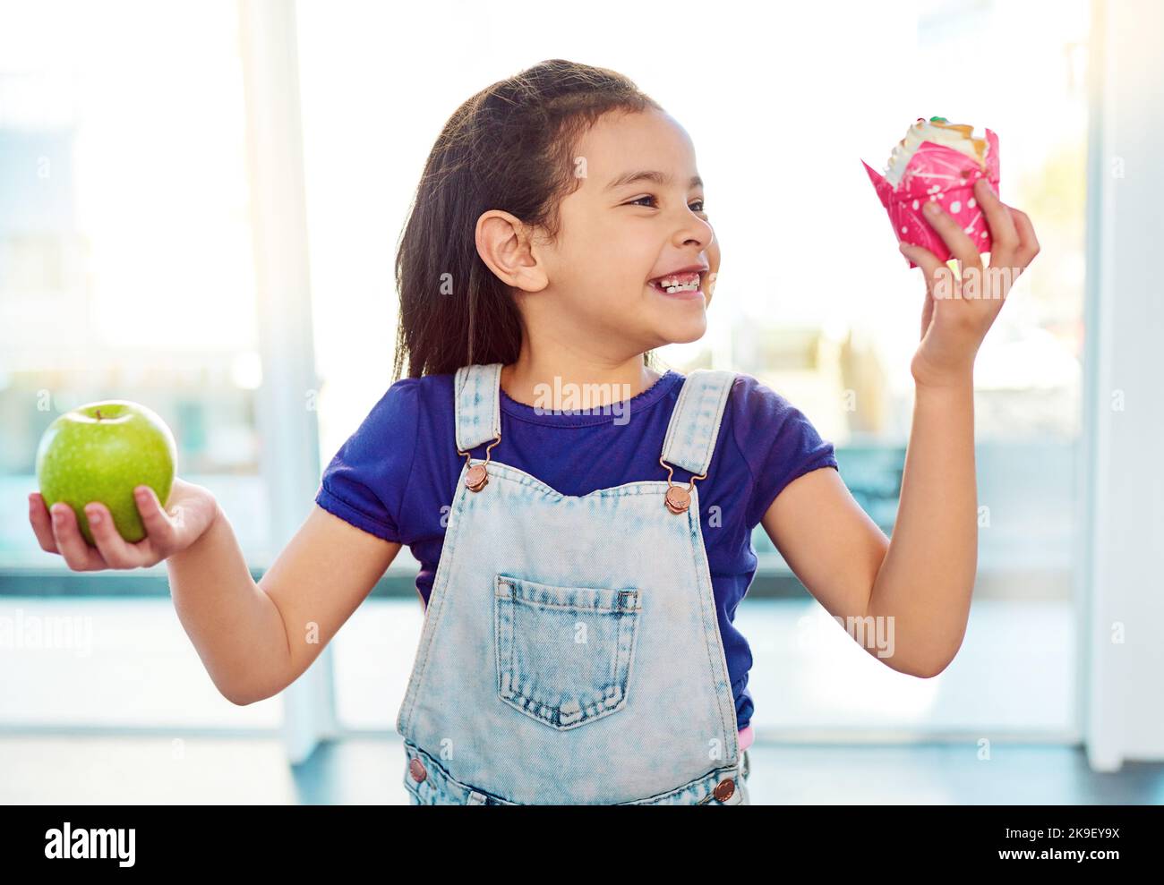Shes always had a sweet tooth. an adorable little girl choosing between ...