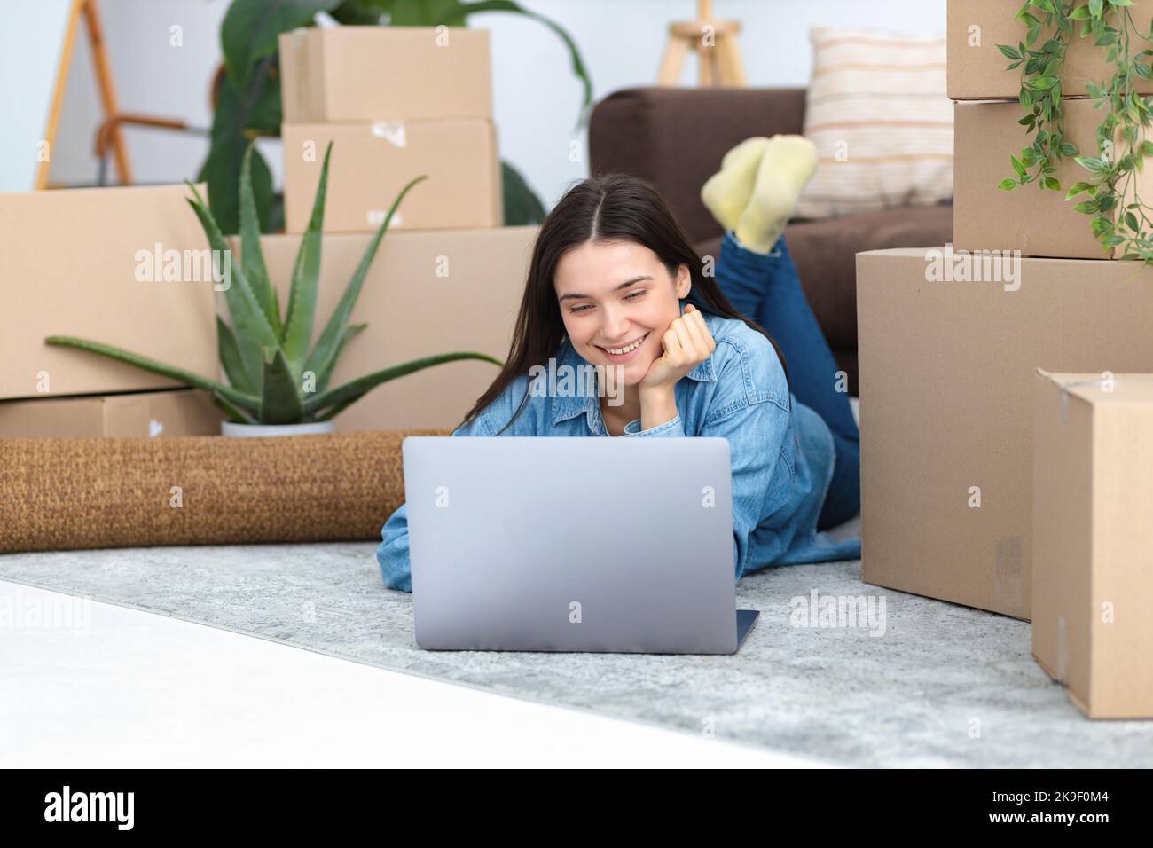 Moving to a new house, rental housing. Happy young caucasian woman ...