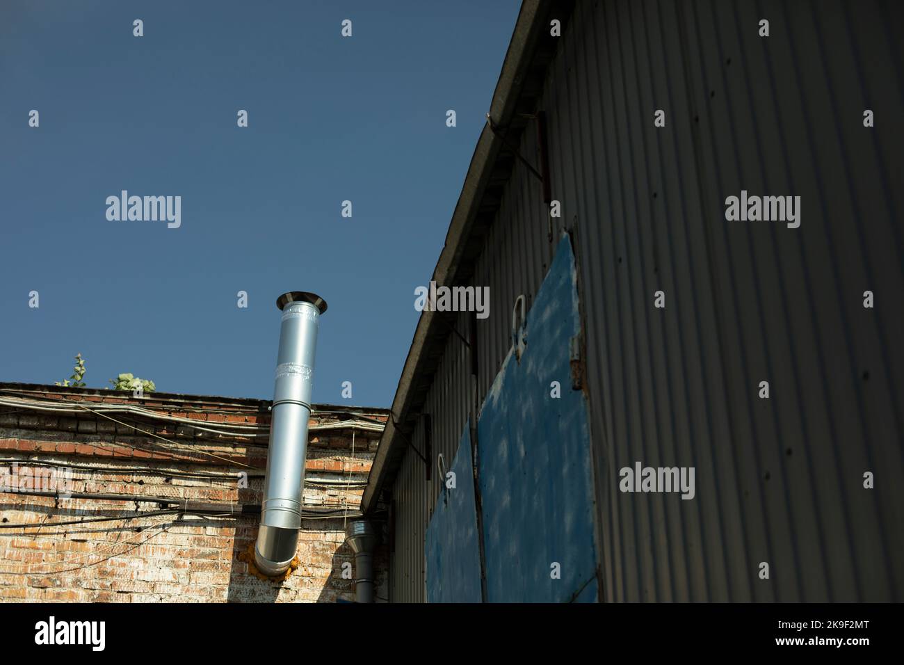 Pipe on roof. Steel pipe on building. Details of industrial area. Old ...