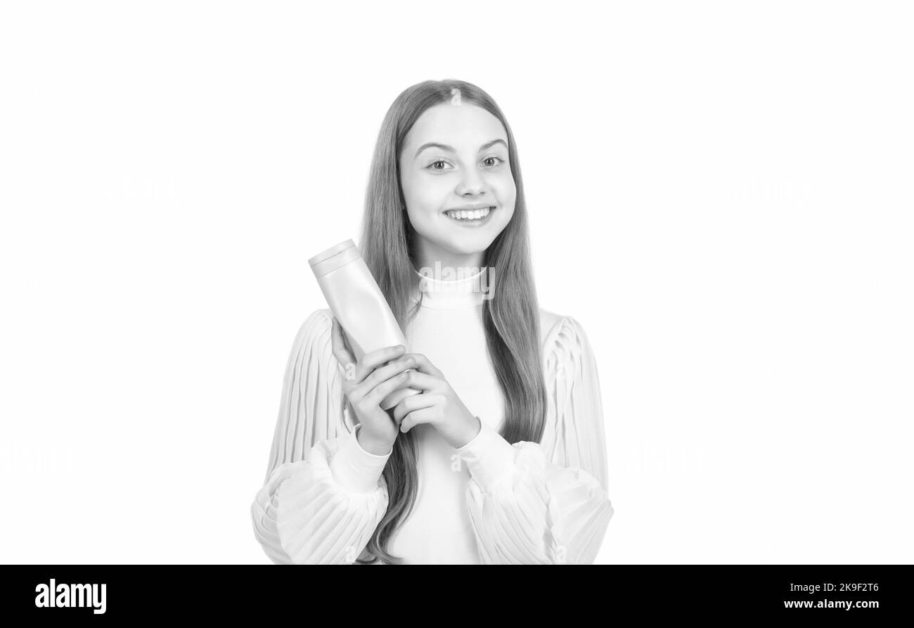 happy child presenting beauty cosmetic product of shampoo hair ...