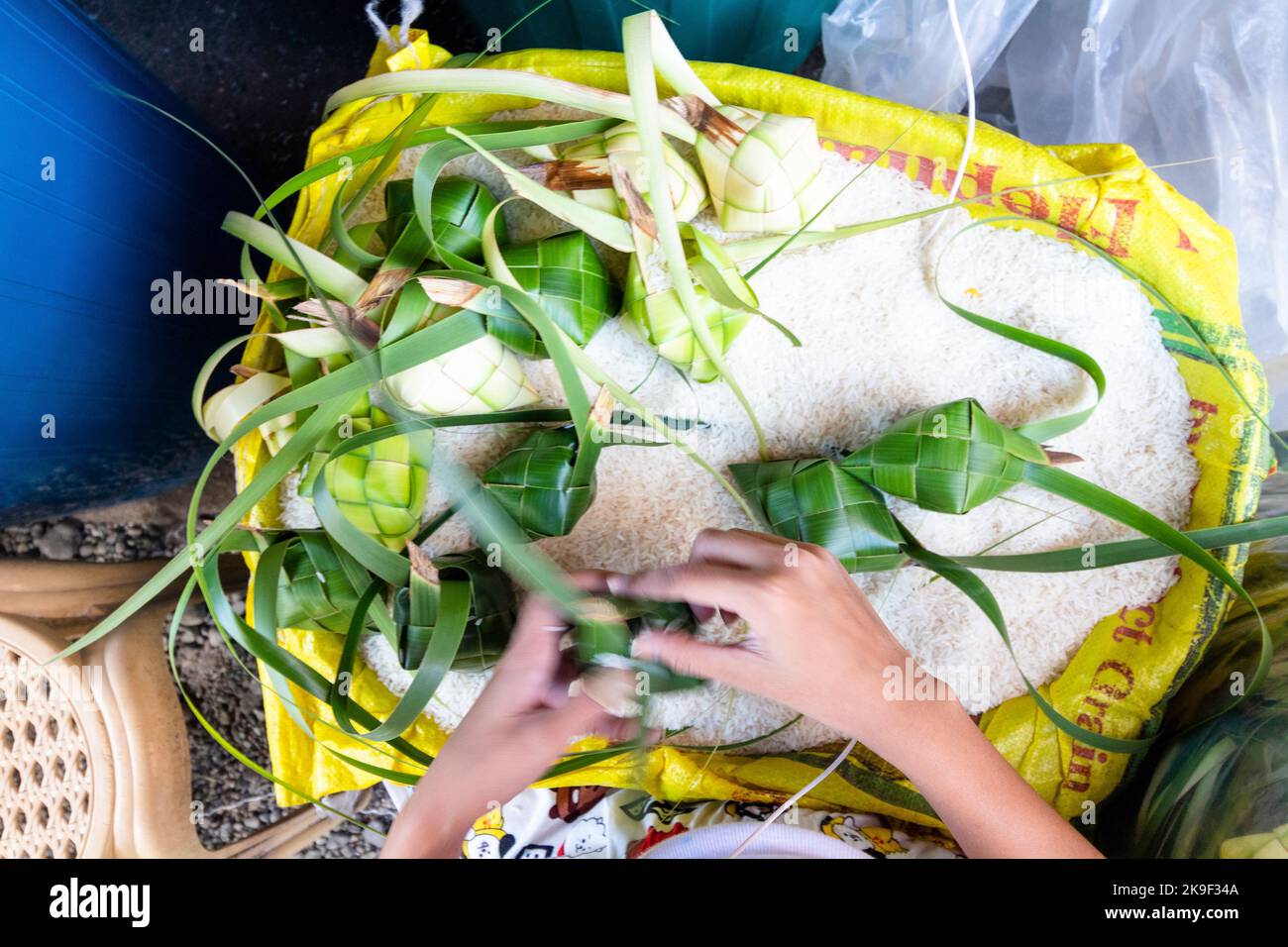 Making hanging rice popularly called puso is a staple in Cebu ...