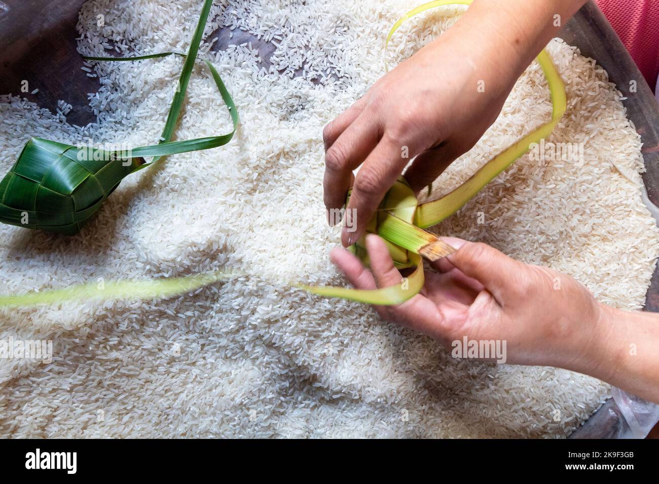 Making hanging rice popularly called puso is a staple in Cebu ...